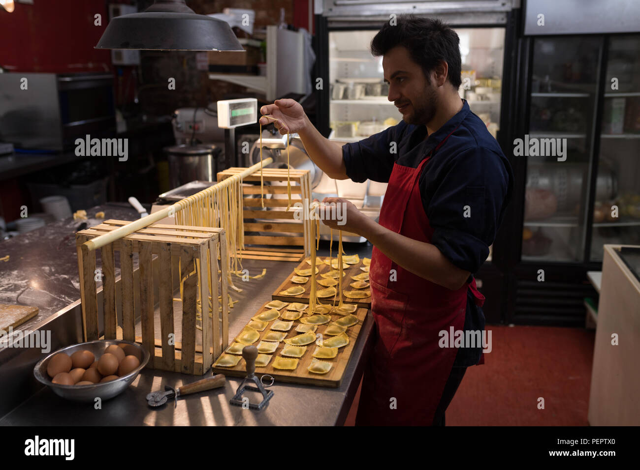 Baker preparing handmade pasta Stock Photo - Alamy