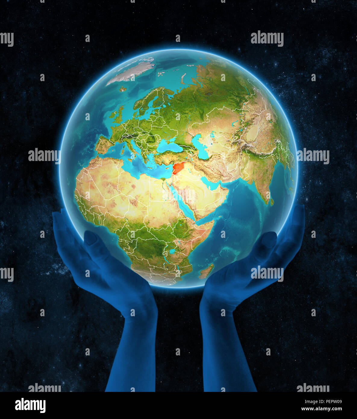 Syria on planet Earth with visible country borders in hands in space ...