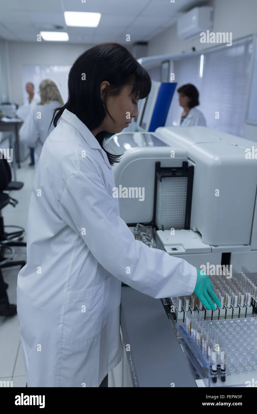 Laboratory technician analyzing chemical solution Stock Photo - Alamy