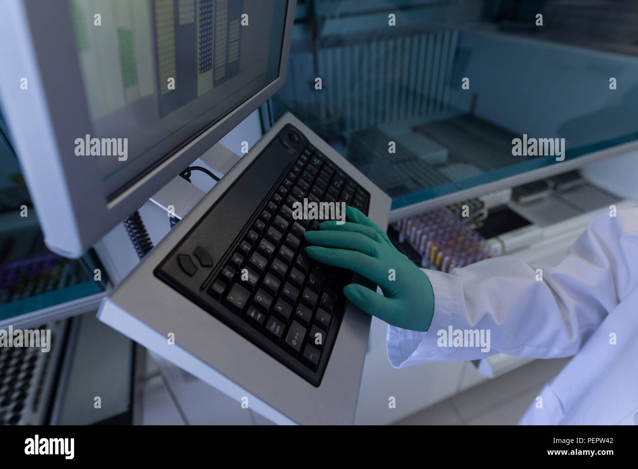 Laboratory technician working on computer Stock Photo - Alamy