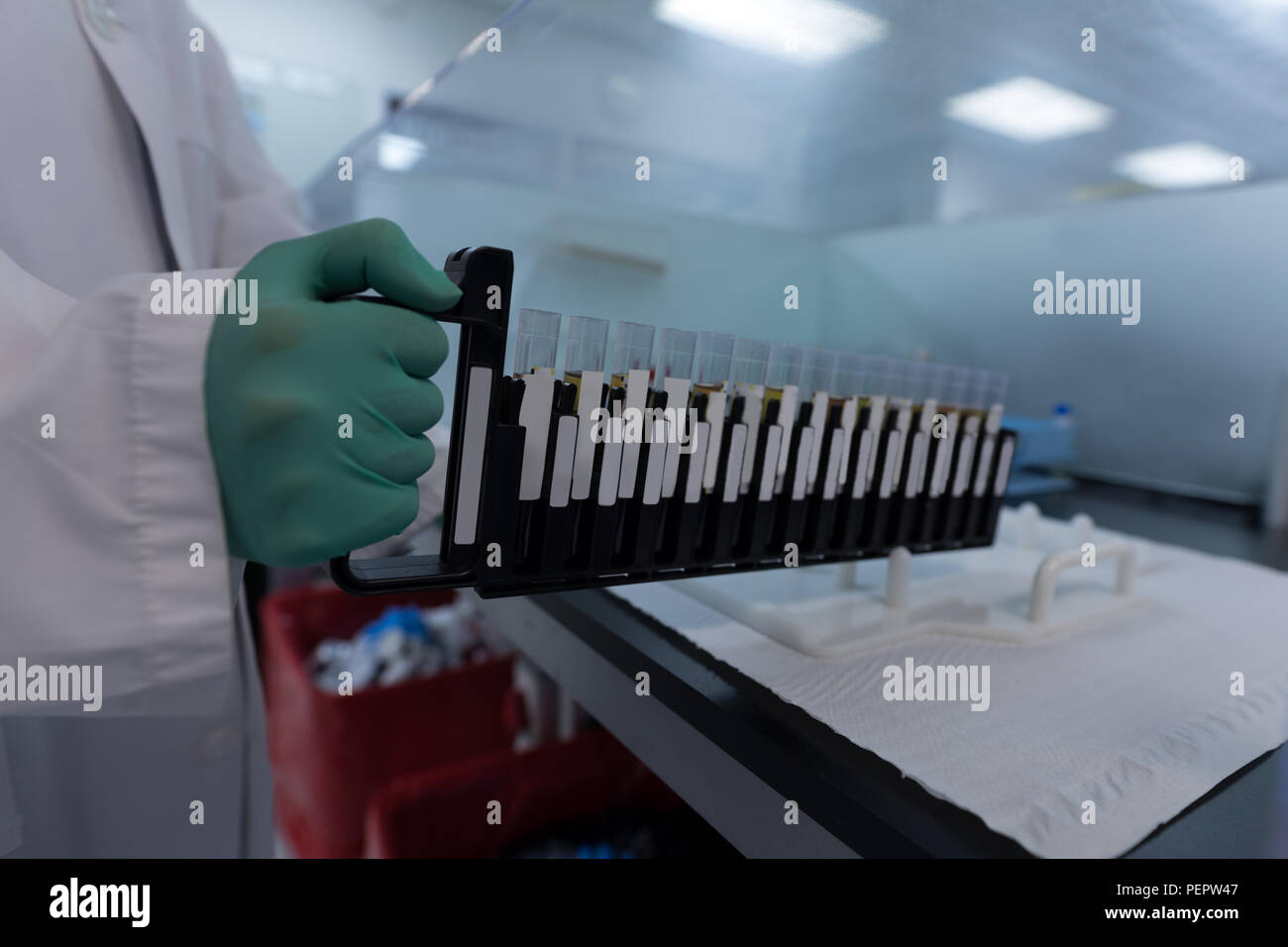 Woman working test tubes hi-res stock photography and images - Alamy