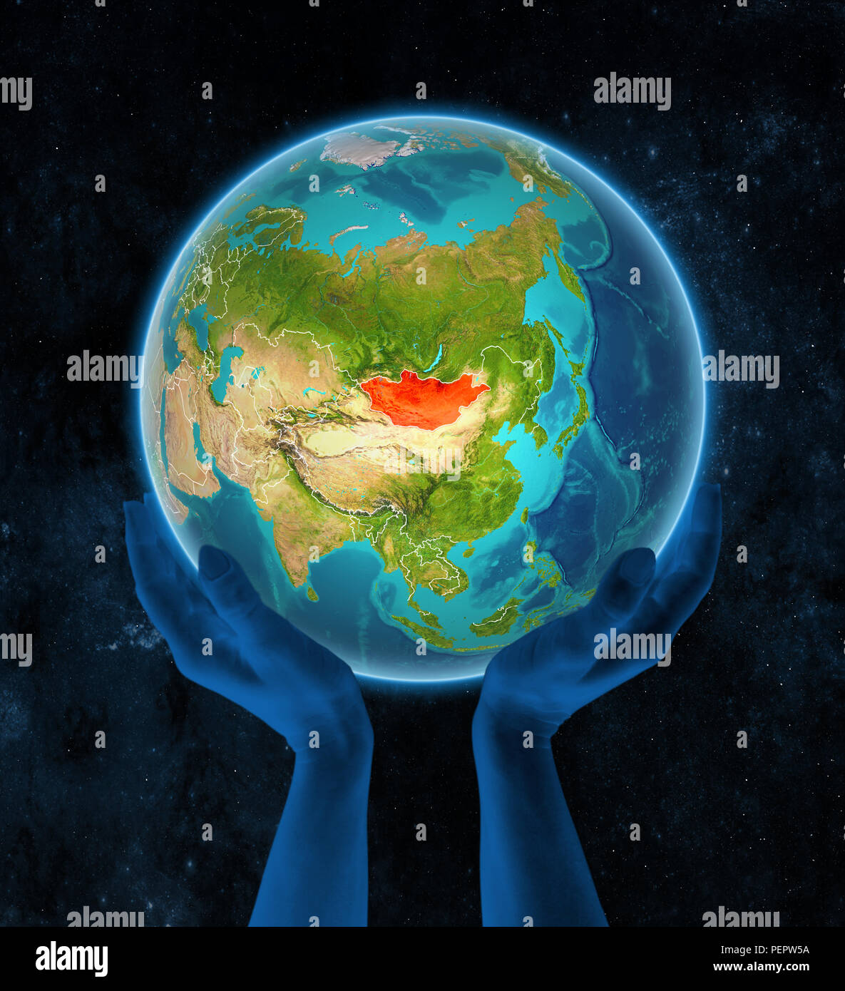 Mongolia on planet Earth with visible country borders in hands in space ...