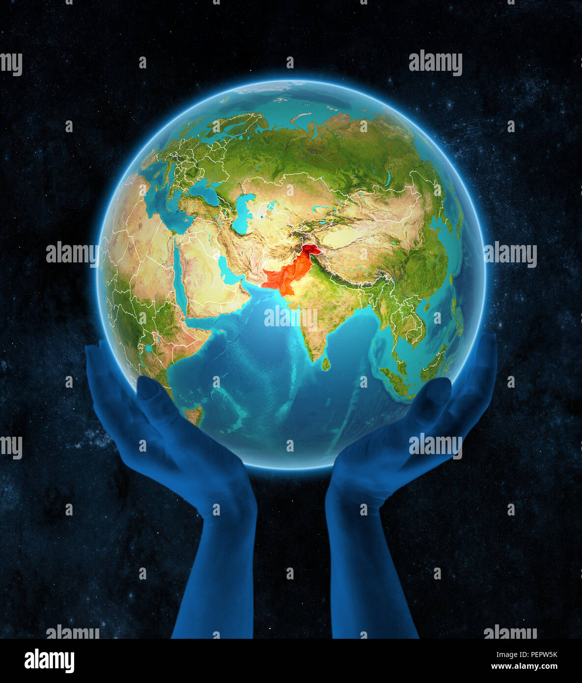 Pakistan on planet Earth with visible country borders in hands in space ...