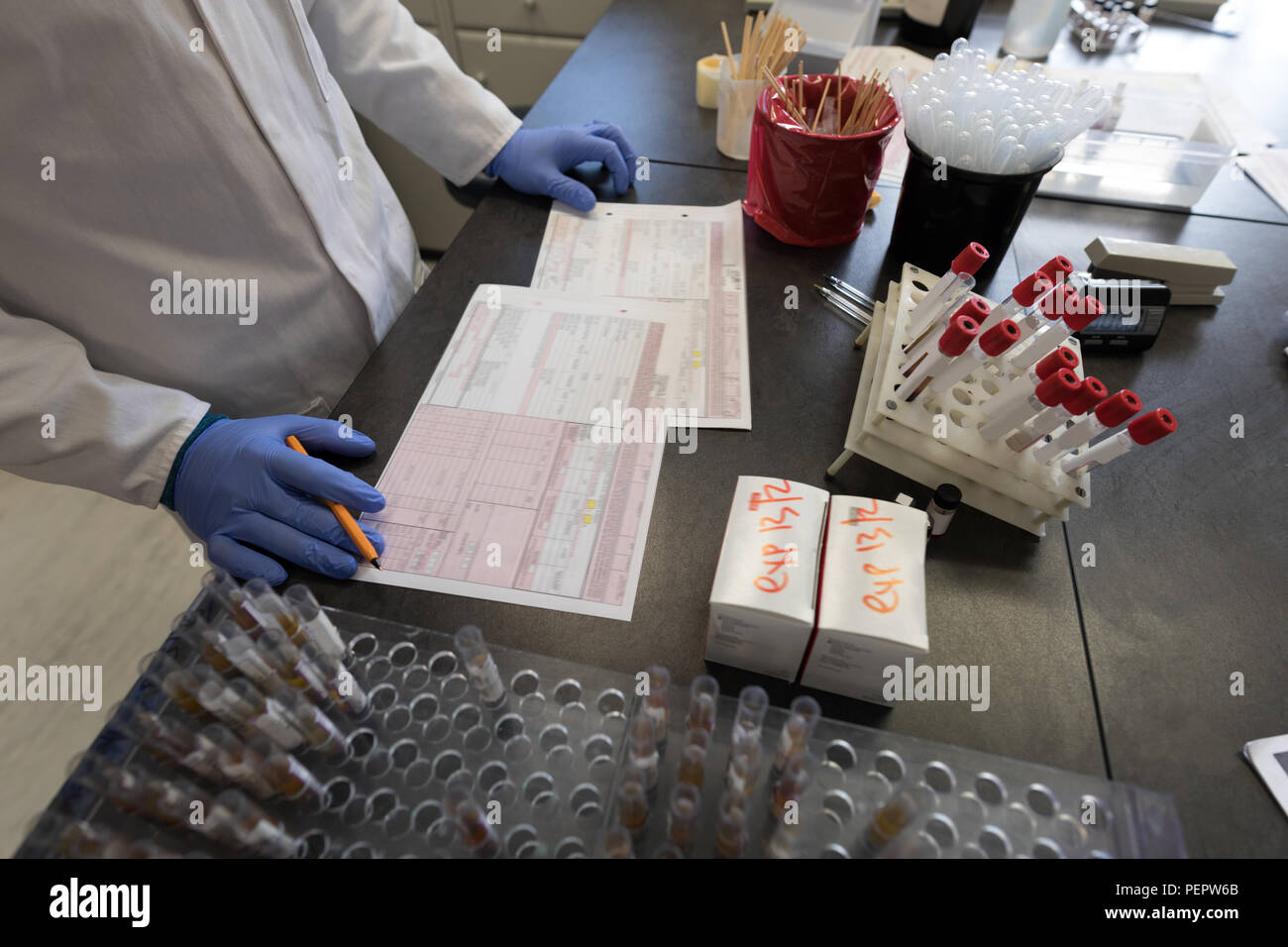 Young male doctor checking blood hi-res stock photography and images ...