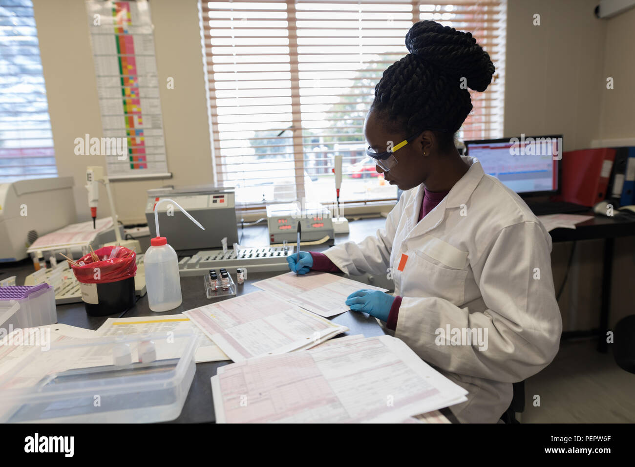 Young male doctor checking blood hi-res stock photography and images ...