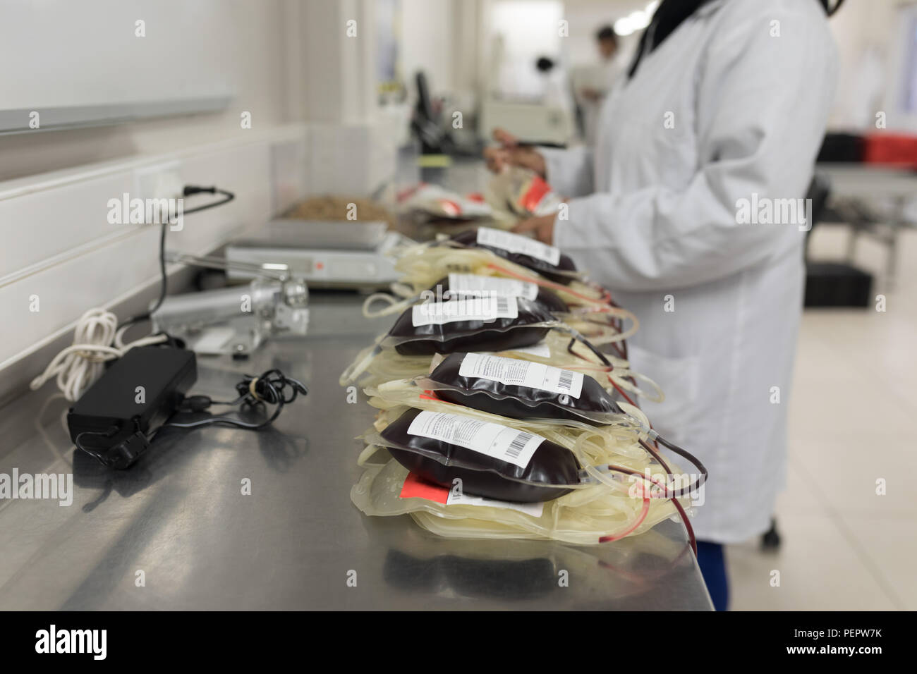Lab technician holding blood sample hi-res stock photography and images ...