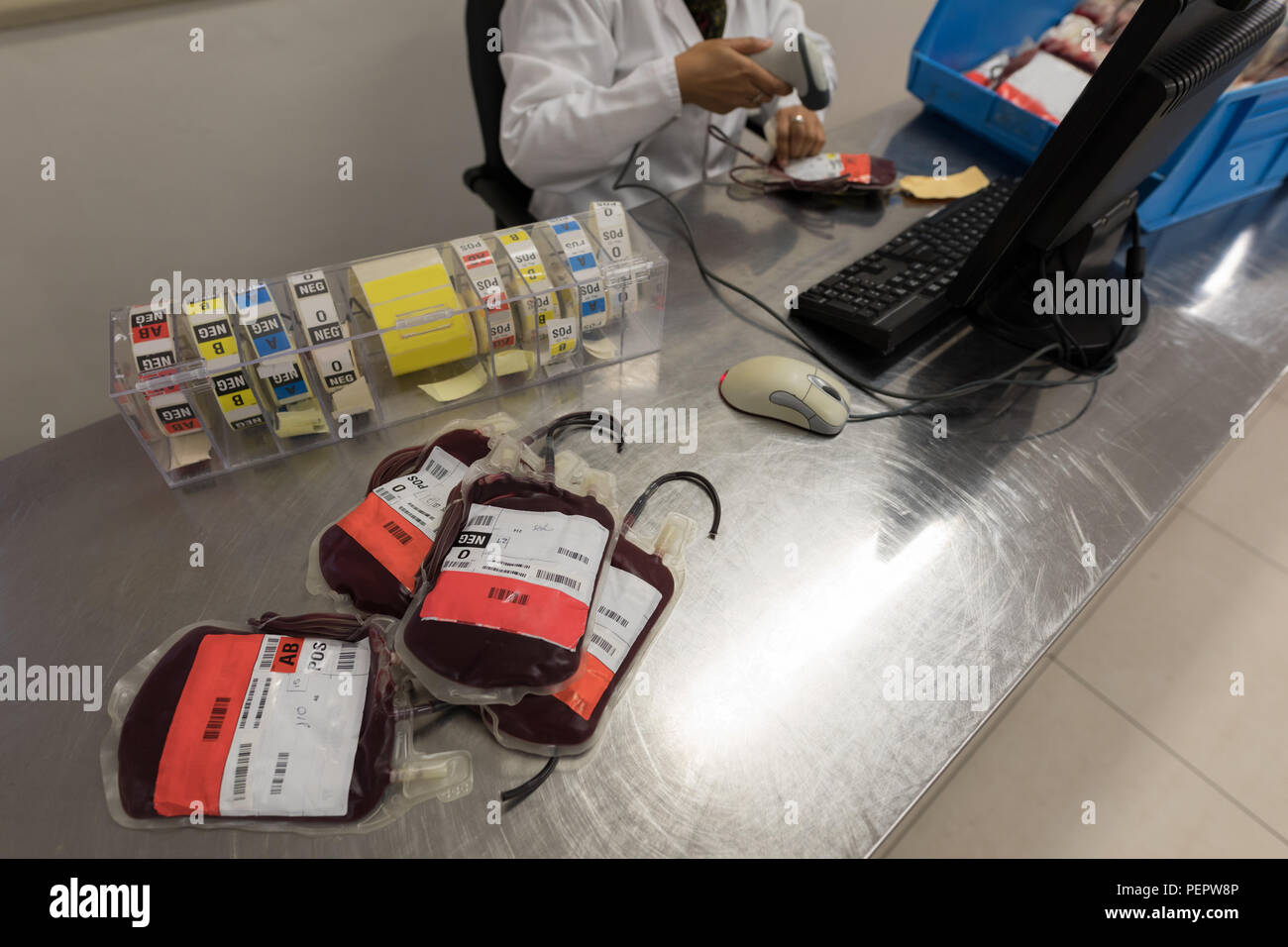 Laboratory technician scanning bar code of blood bags Stock Photo - Alamy Laboratory technician scanning bar code of blood bags Stock Photo - Alamy