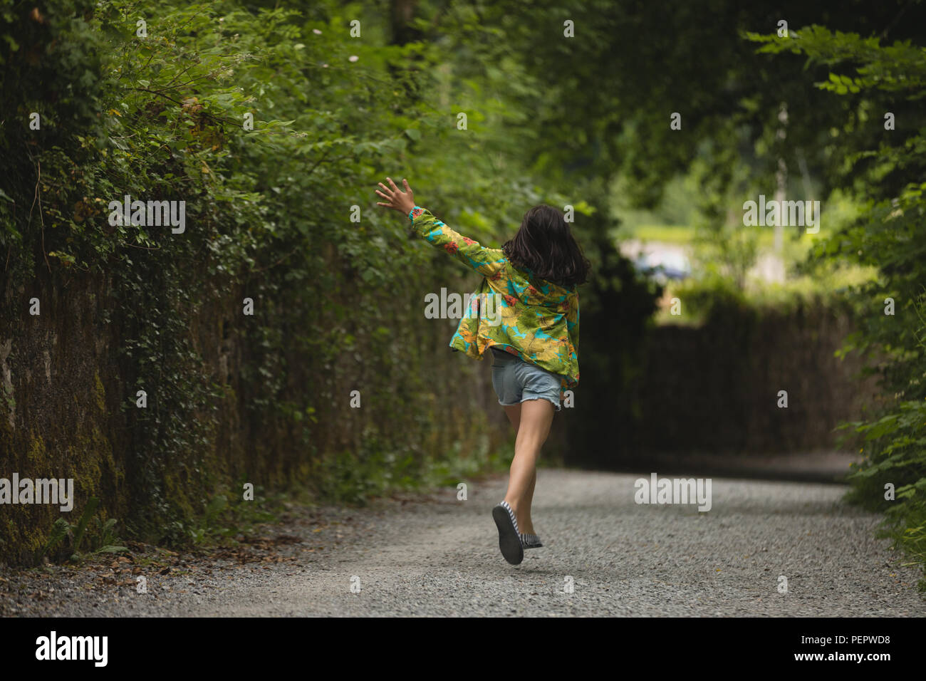 Girl playing on street Stock Photo - Alamy