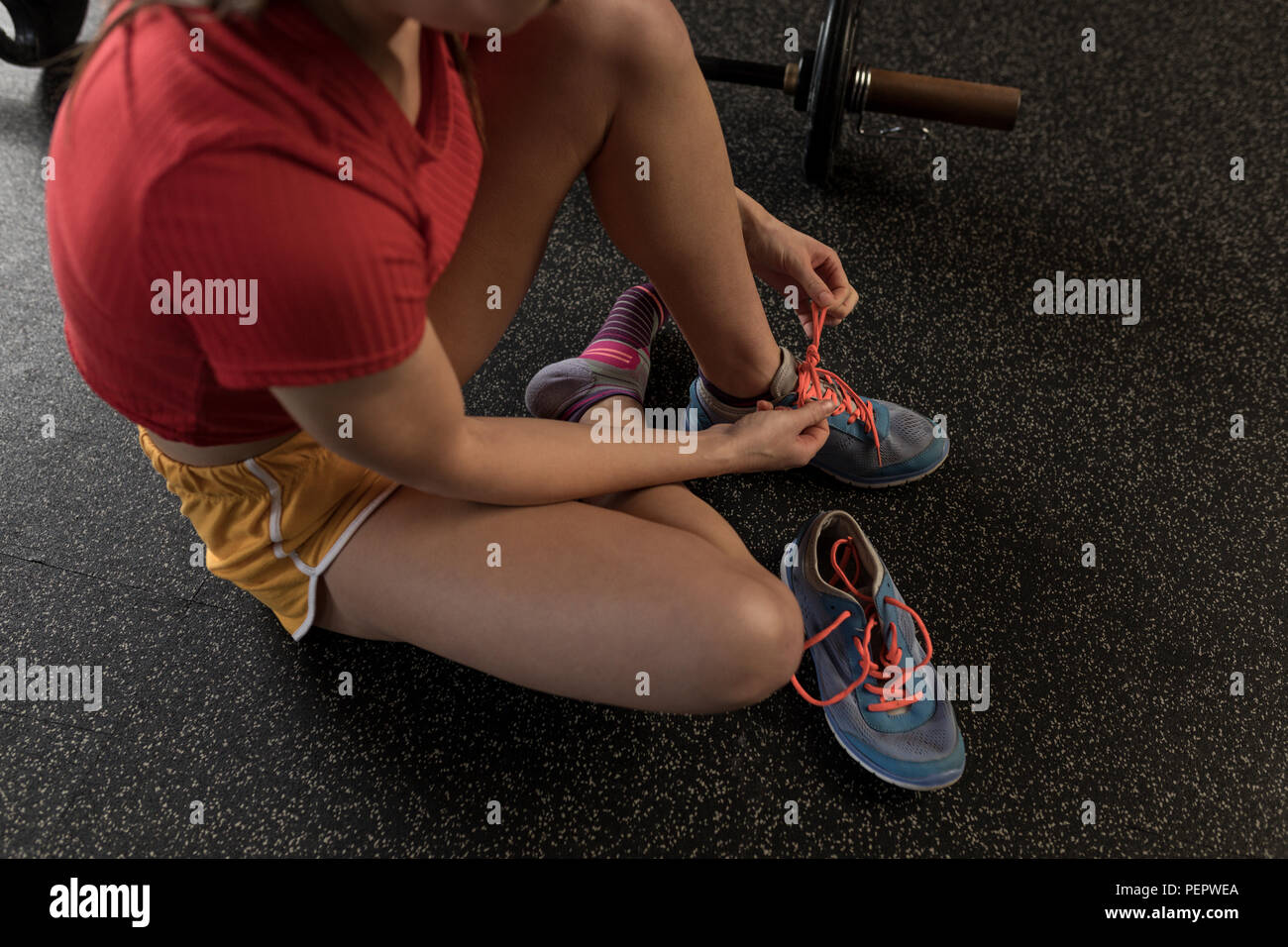 Woman tying sports shoe hi-res stock photography and images - Alamy