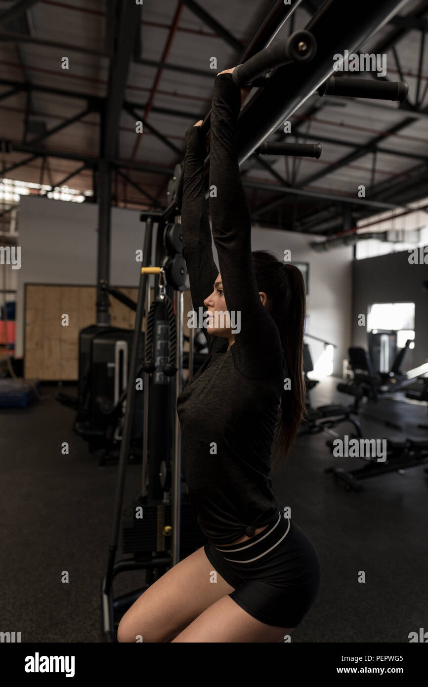 Woman doing pull ups in hi-res stock photography and images - Alamy