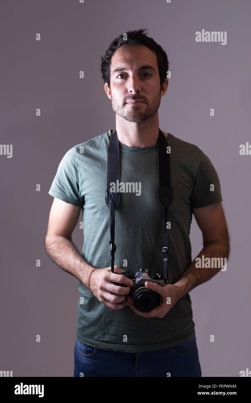 Man standing holding camera hi-res stock photography and images - Alamy