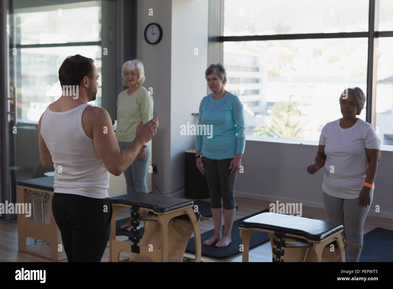Female trainer training senior hi-res stock photography and images - Alamy