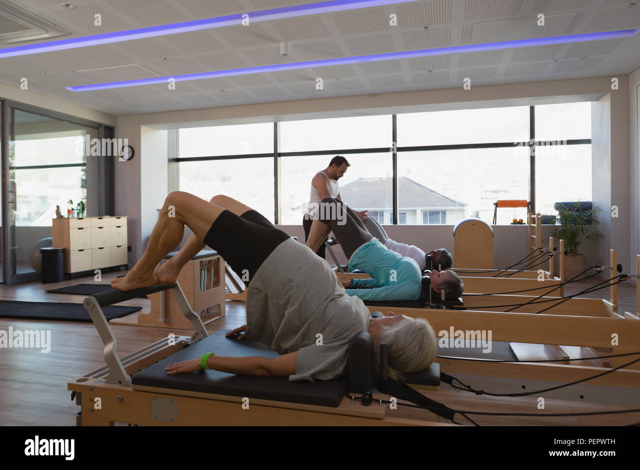 Female trainer training senior hi-res stock photography and images - Alamy