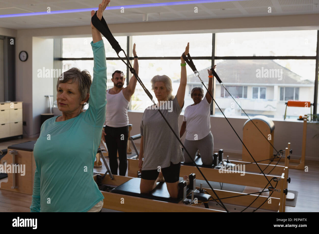 Group of senior women doing stretching exercise Stock Photo - Alamy