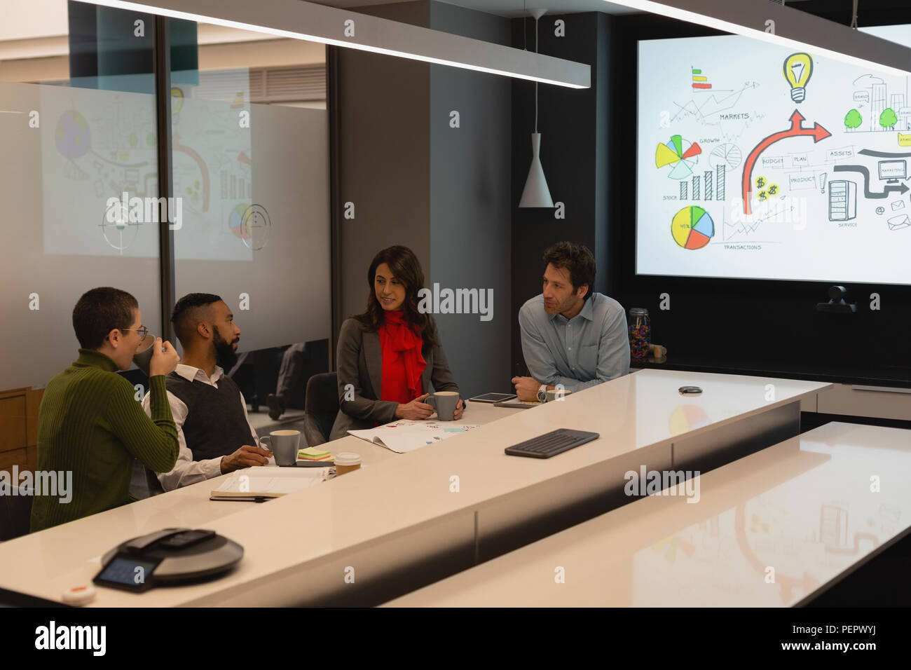 Business people interacting in conference room Stock Photo - Alamy