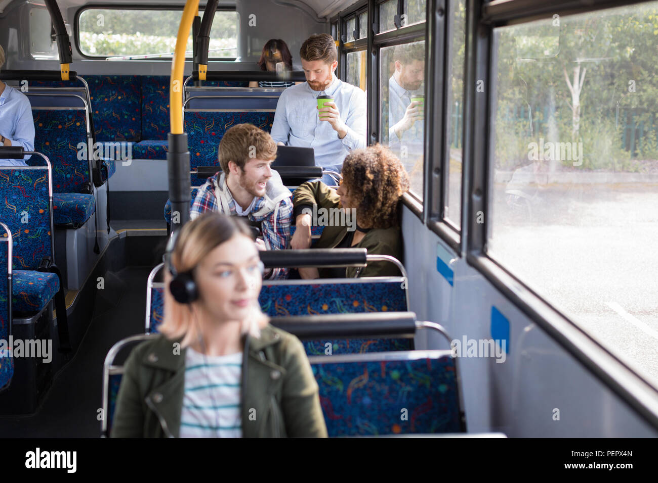 Couple travelling in bus Stock Photo - Alamy