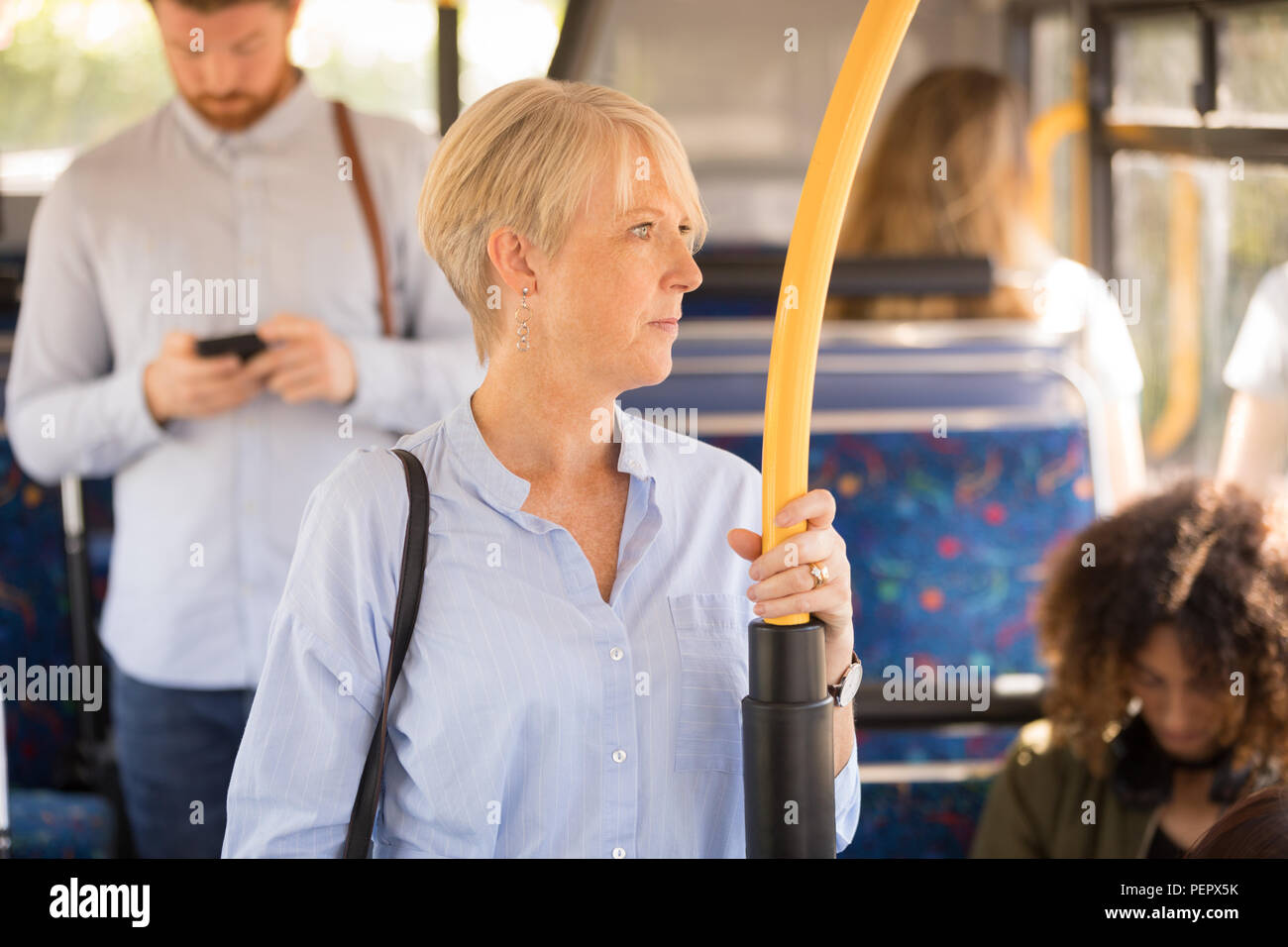 Passenger bus standing woman holding hi-res stock photography and ...