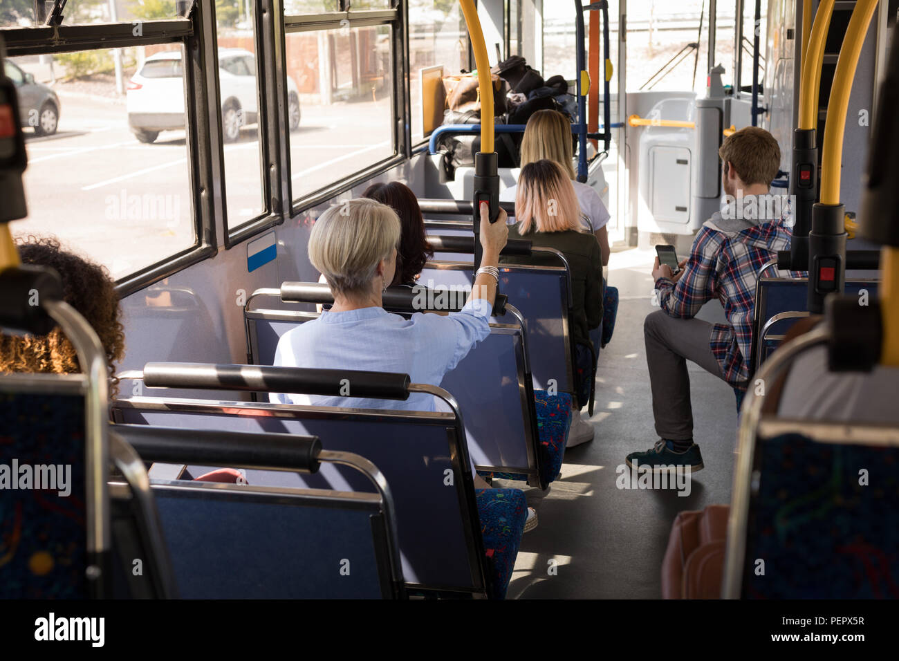 Commuters travelling in modern bus Stock Photo - Alamy