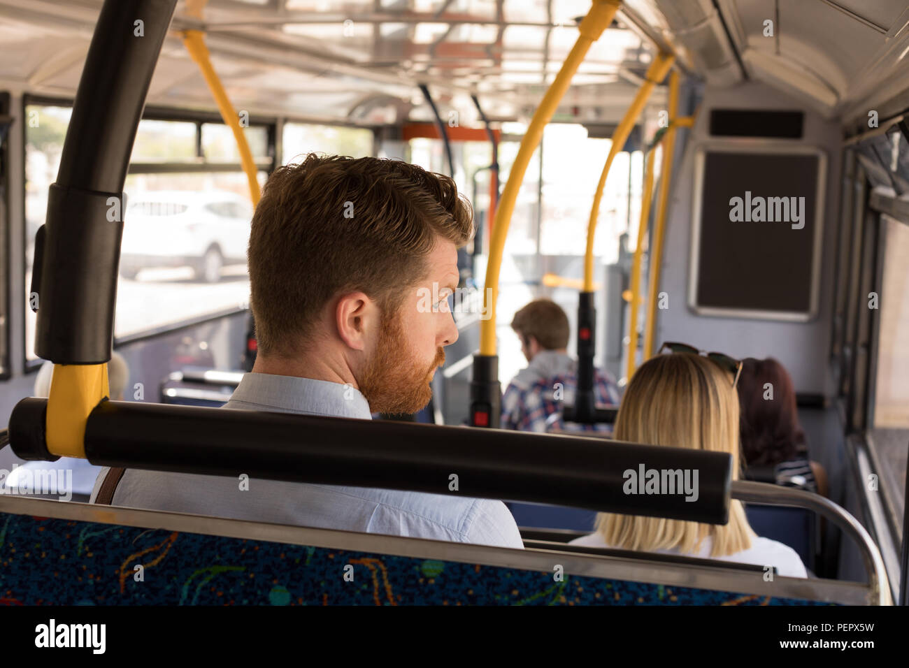 Man travelling in modern bus Stock Photo - Alamy