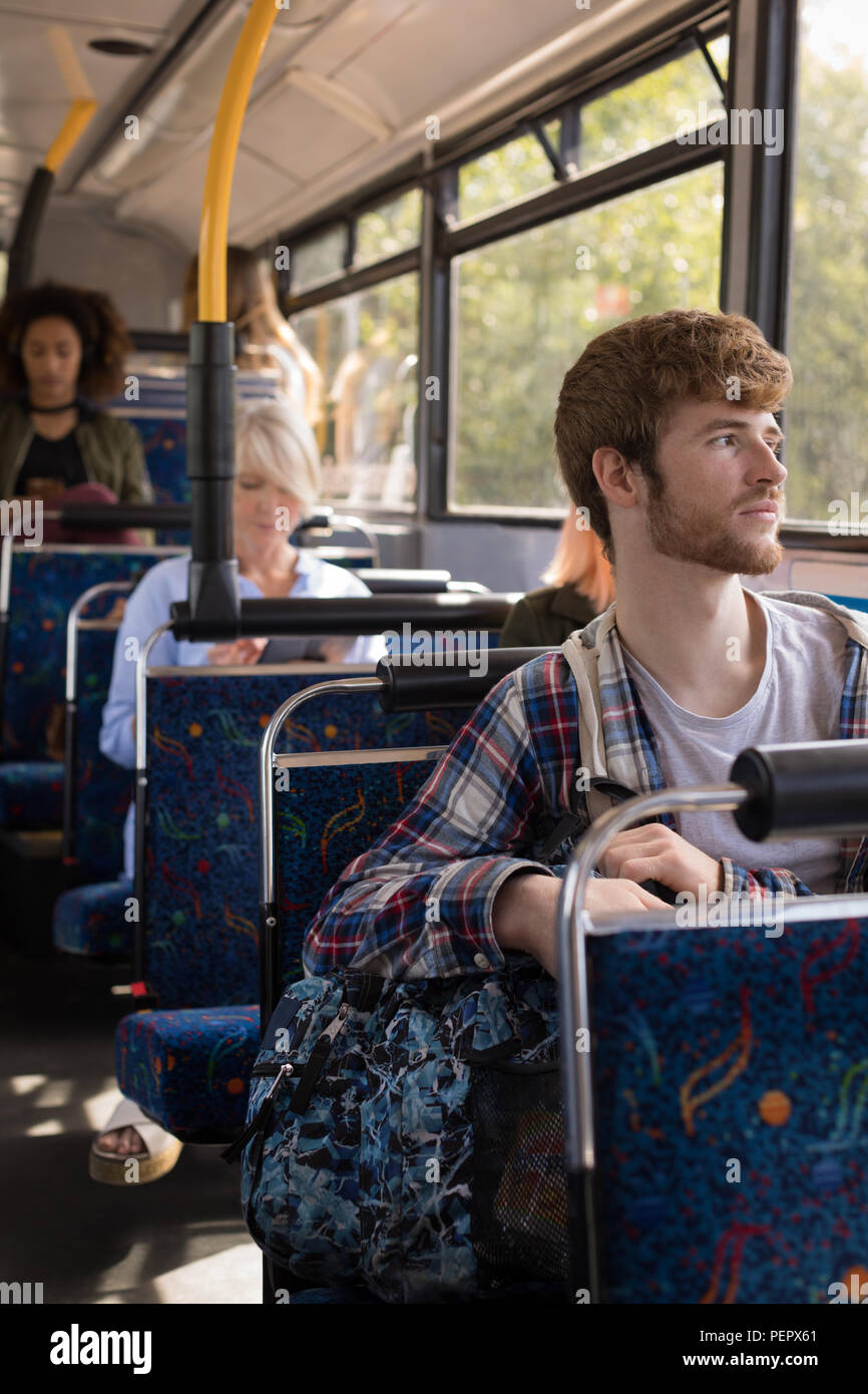 Man travelling in modern bus Stock Photo - Alamy