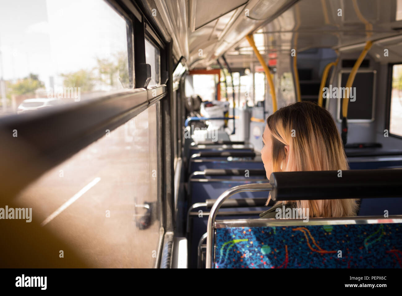 Female commuter travelling in bus Stock Photo - Alamy