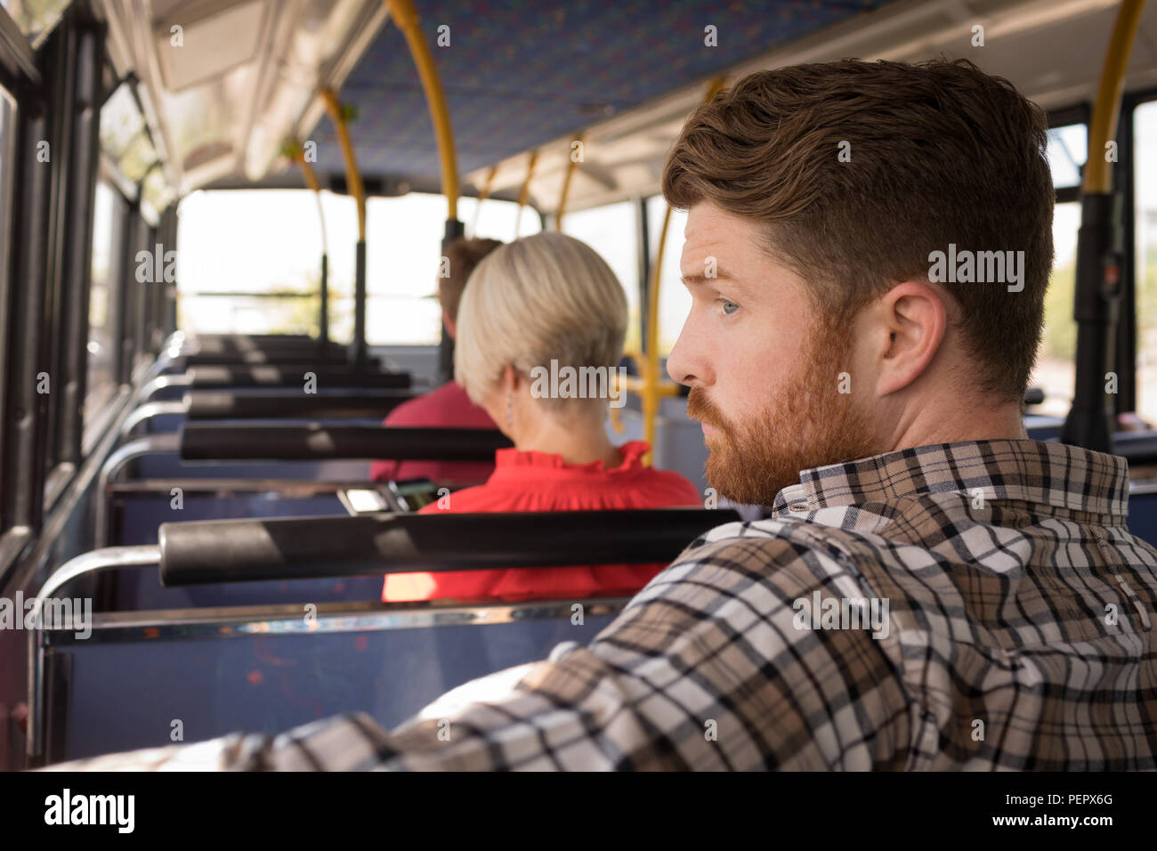 Male commuter travelling in modern bus Stock Photo - Alamy