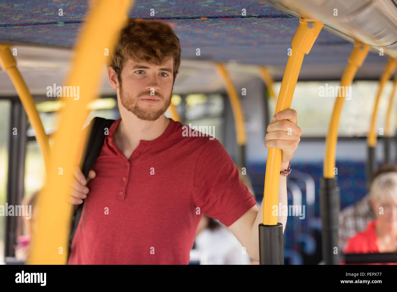 Male commuter travelling in modern bus Stock Photo - Alamy