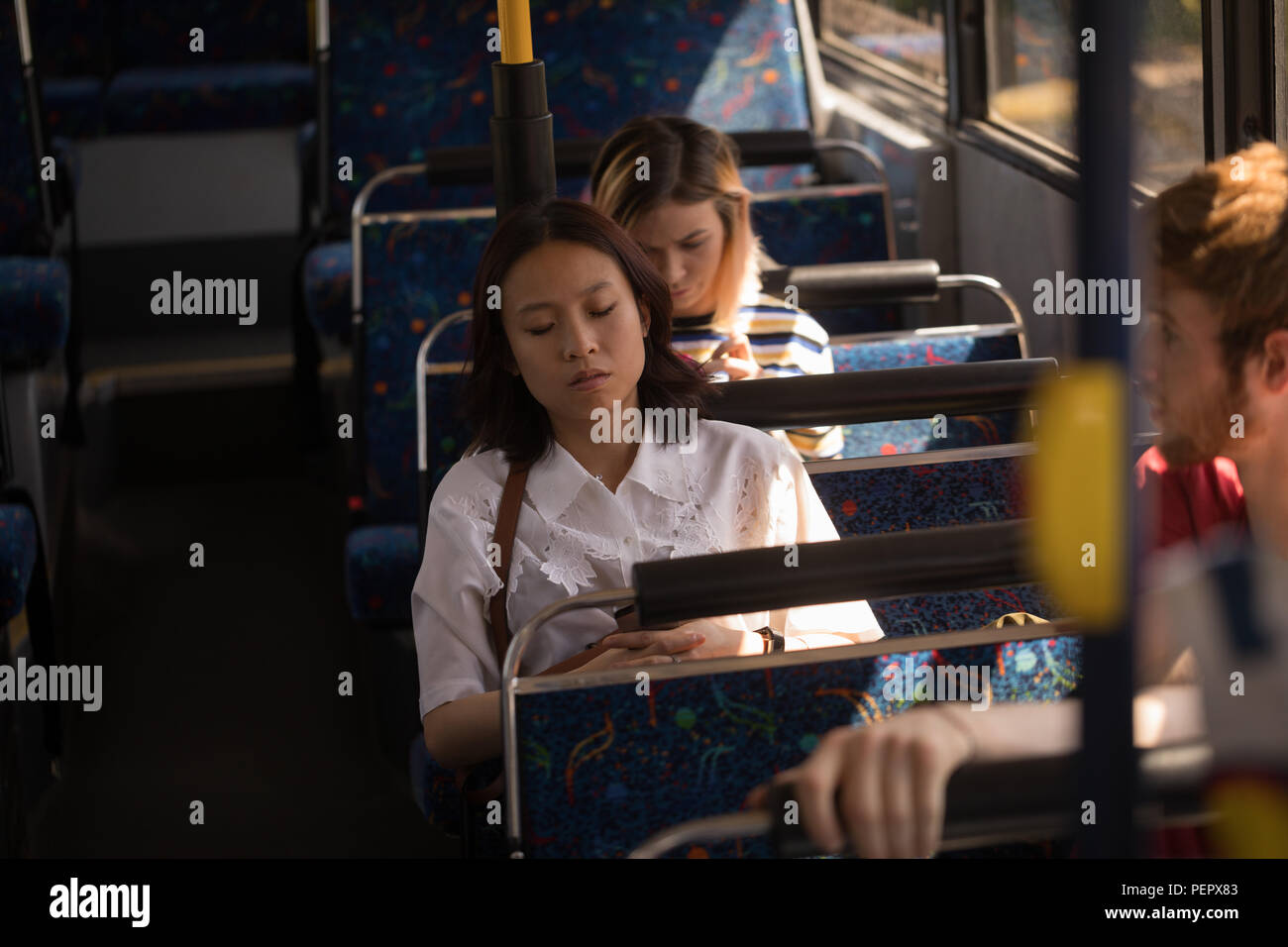 Mobile use bus passenger hi-res stock photography and images - Alamy
