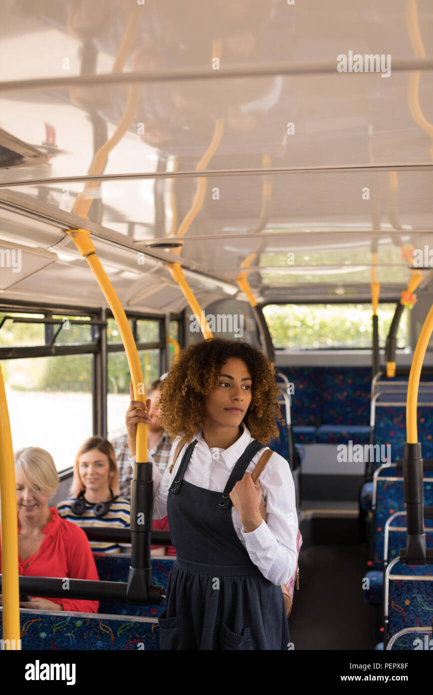 Female commuter travelling in modern bus Stock Photo - Alamy