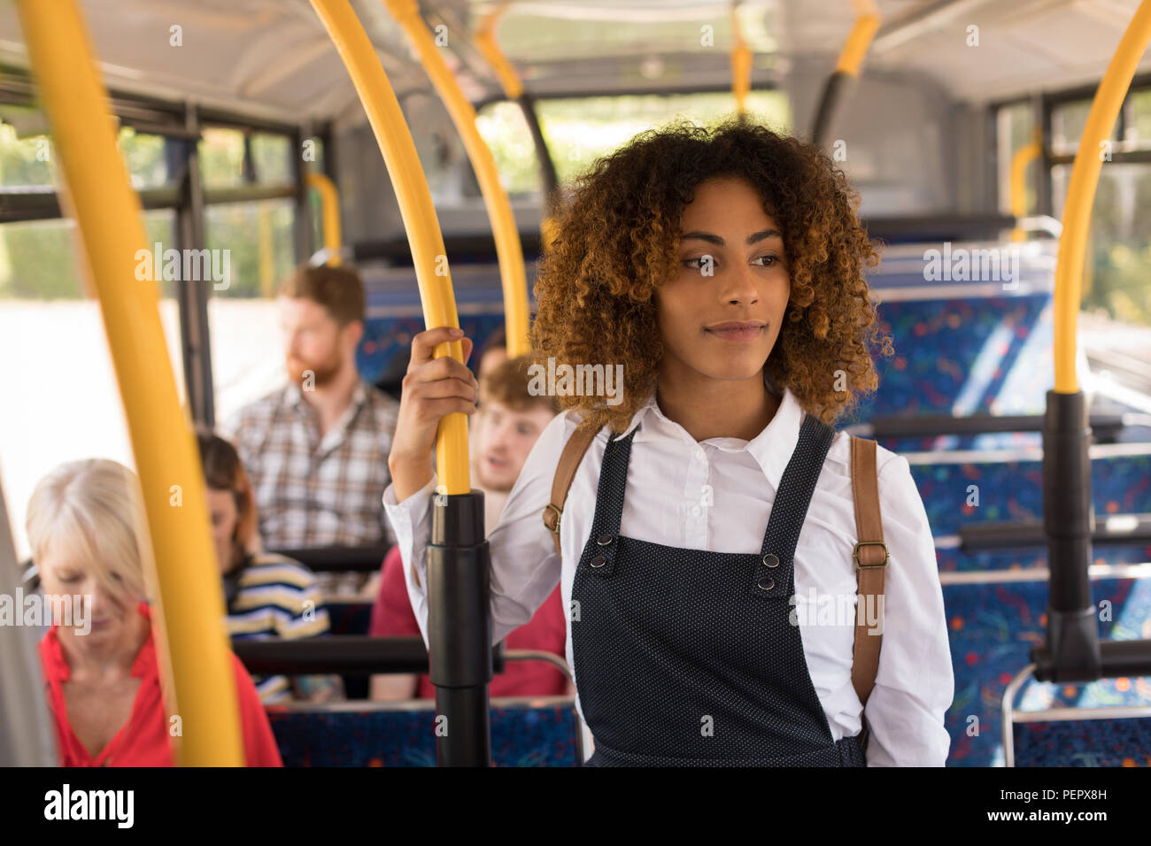 Female commuter travelling in modern bus Stock Photo - Alamy