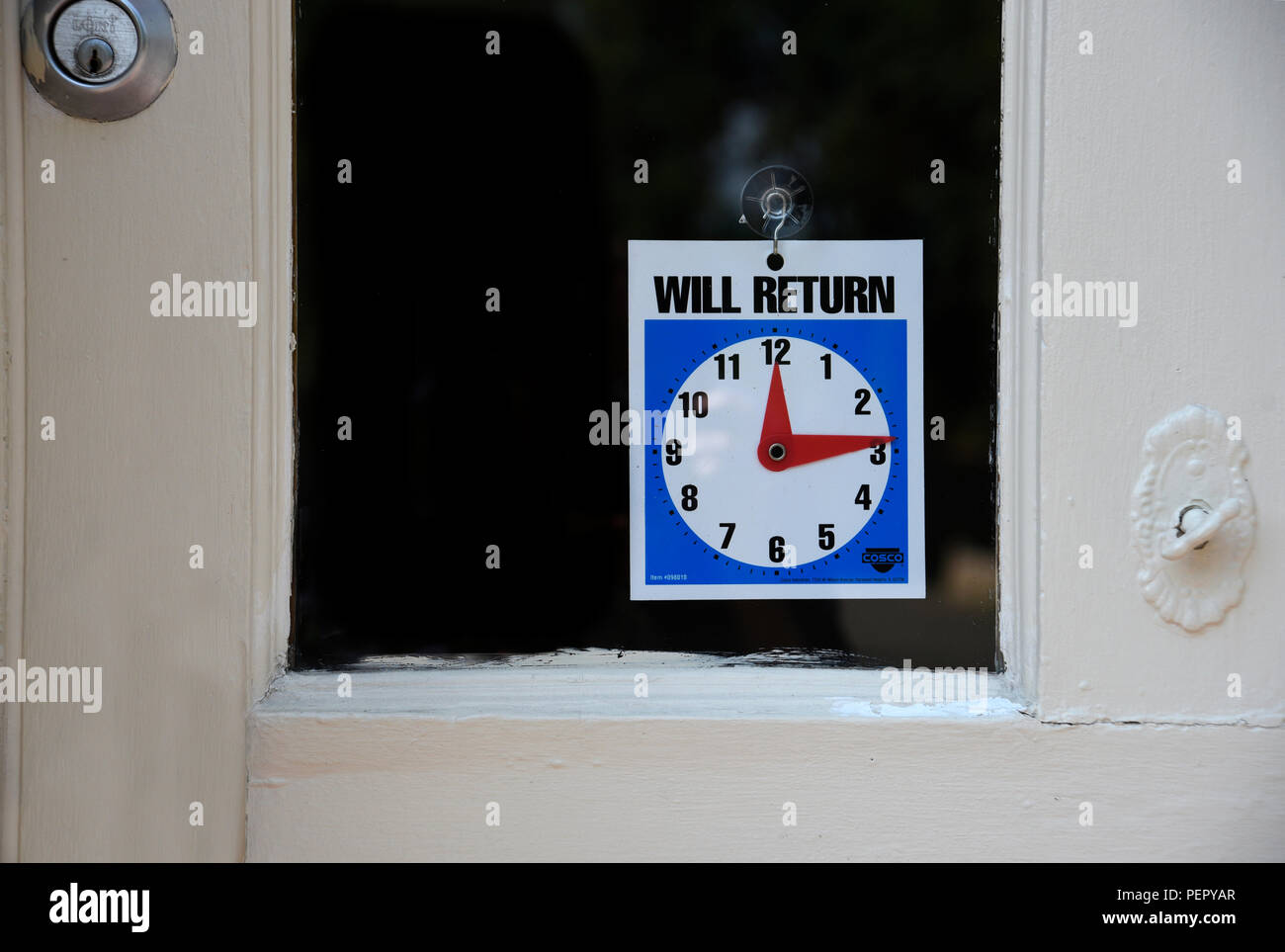 A ‘will return’ sign hanging on the front door of a retail shop Stock ...