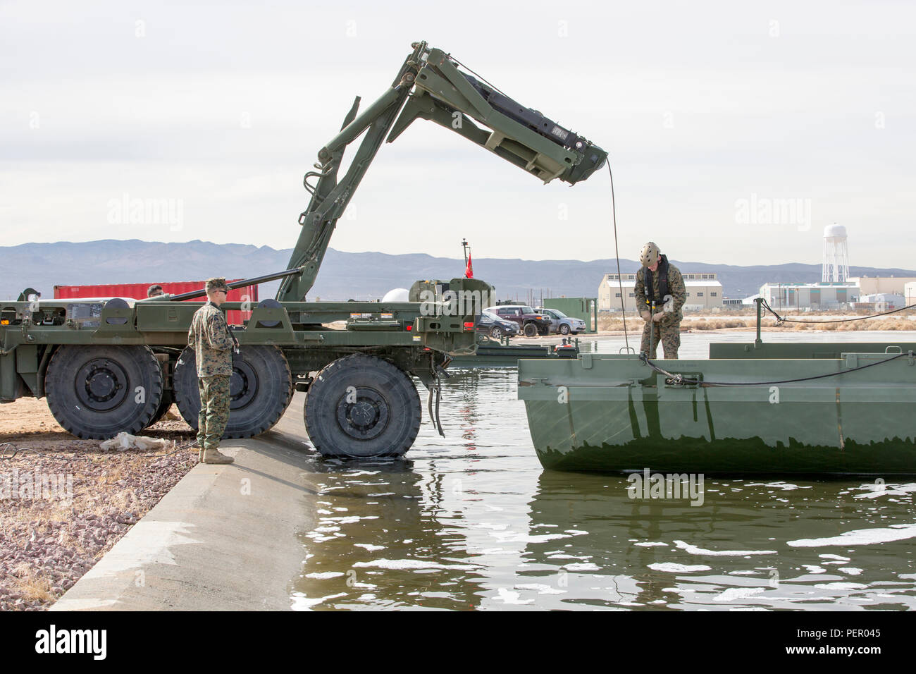 Marines from 7th ESB test an improved ribbon bridge section at the ...