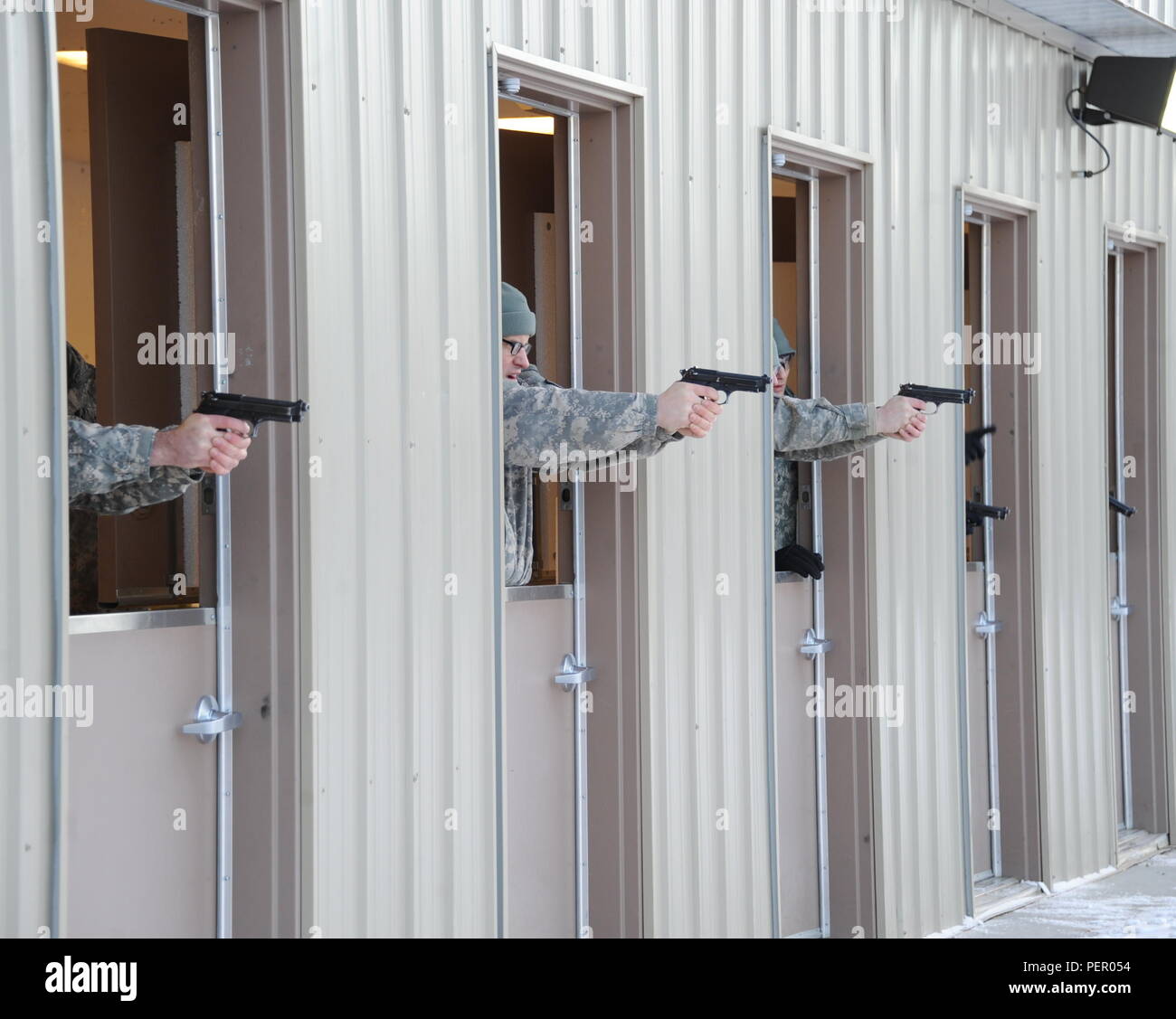 Soldiers from the 49th Missile Defense Battalion fire M9 pistols from ...