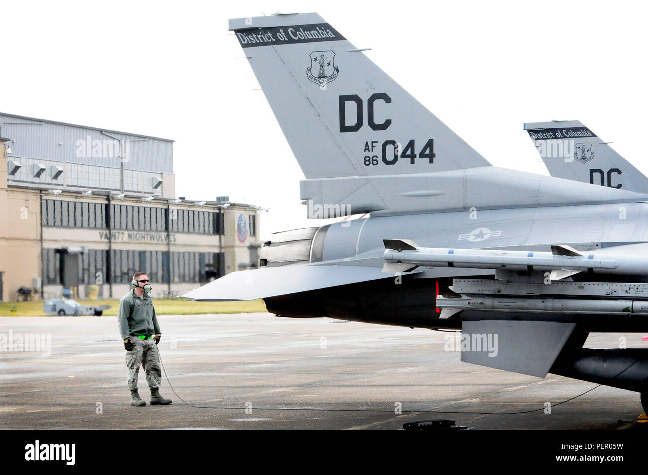 113th Wing crew chief Staff Sgt. Samuel Baughman prepares an F-16 for a ...
