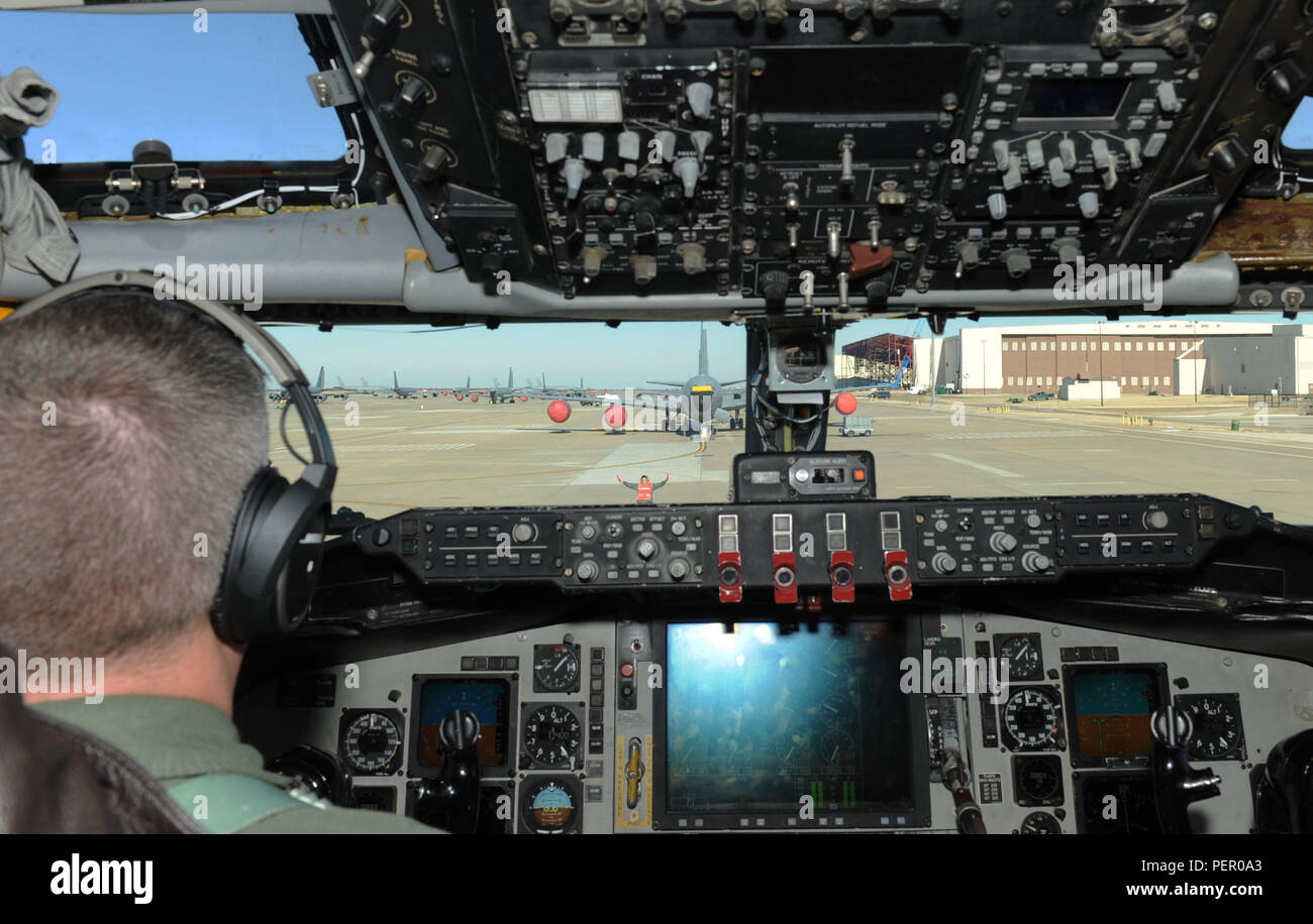 A 22nd Aircraft Maintenance Squadron crew chief marshals a KC-135 ...