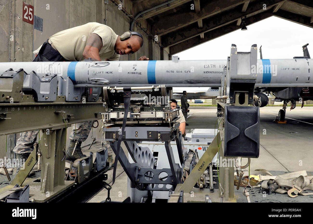 A U.S. Air Force weapons load crew team from the 67th Aircraft ...