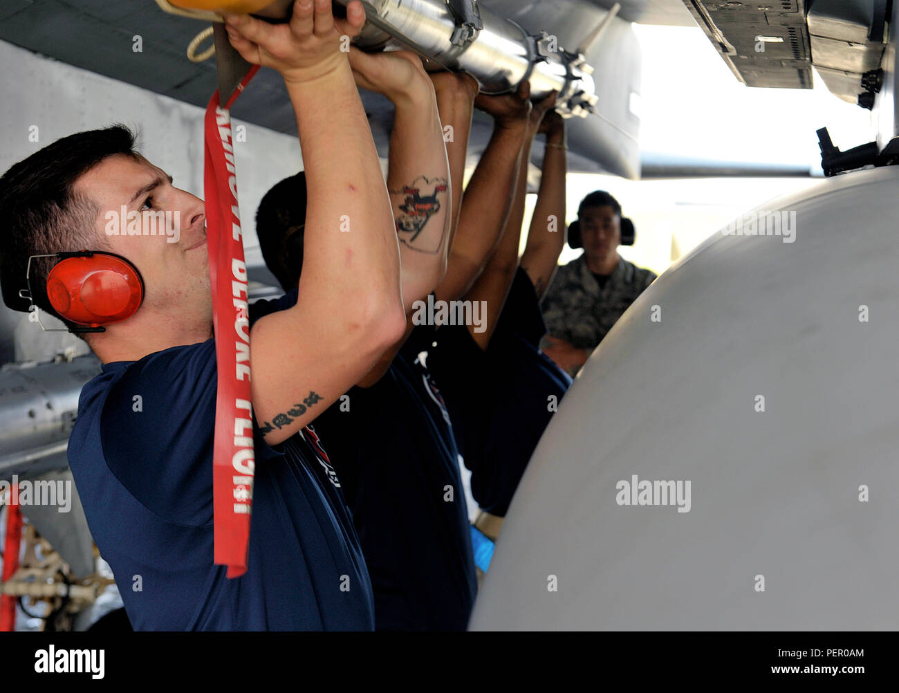 A U.S. Air Force weapons load crew team from the 44th Aircraft ...