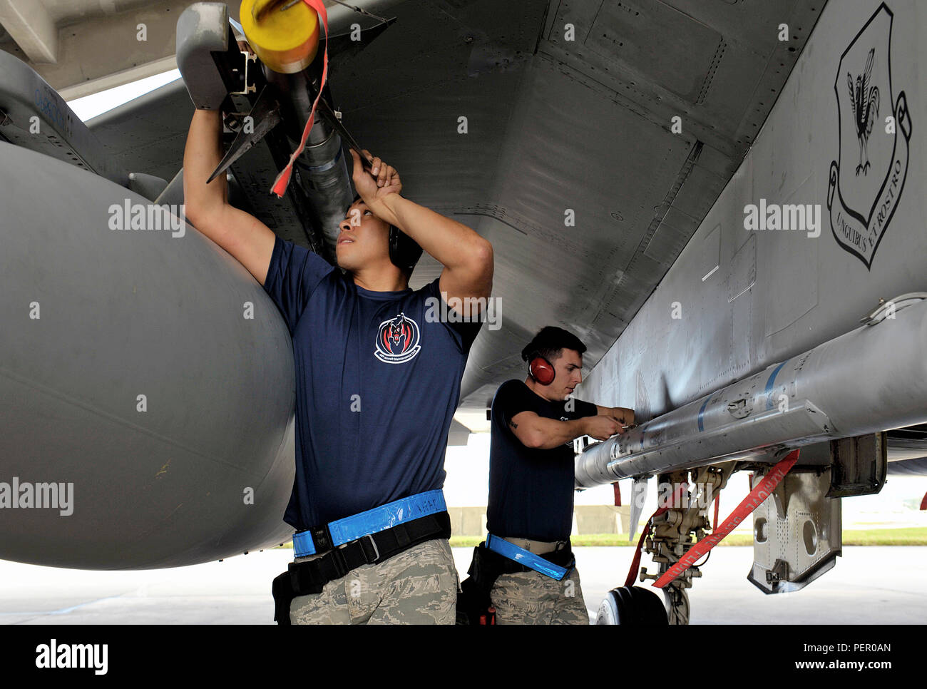 A U.S. Air Force weapons load crew team from the 44th Aircraft ...