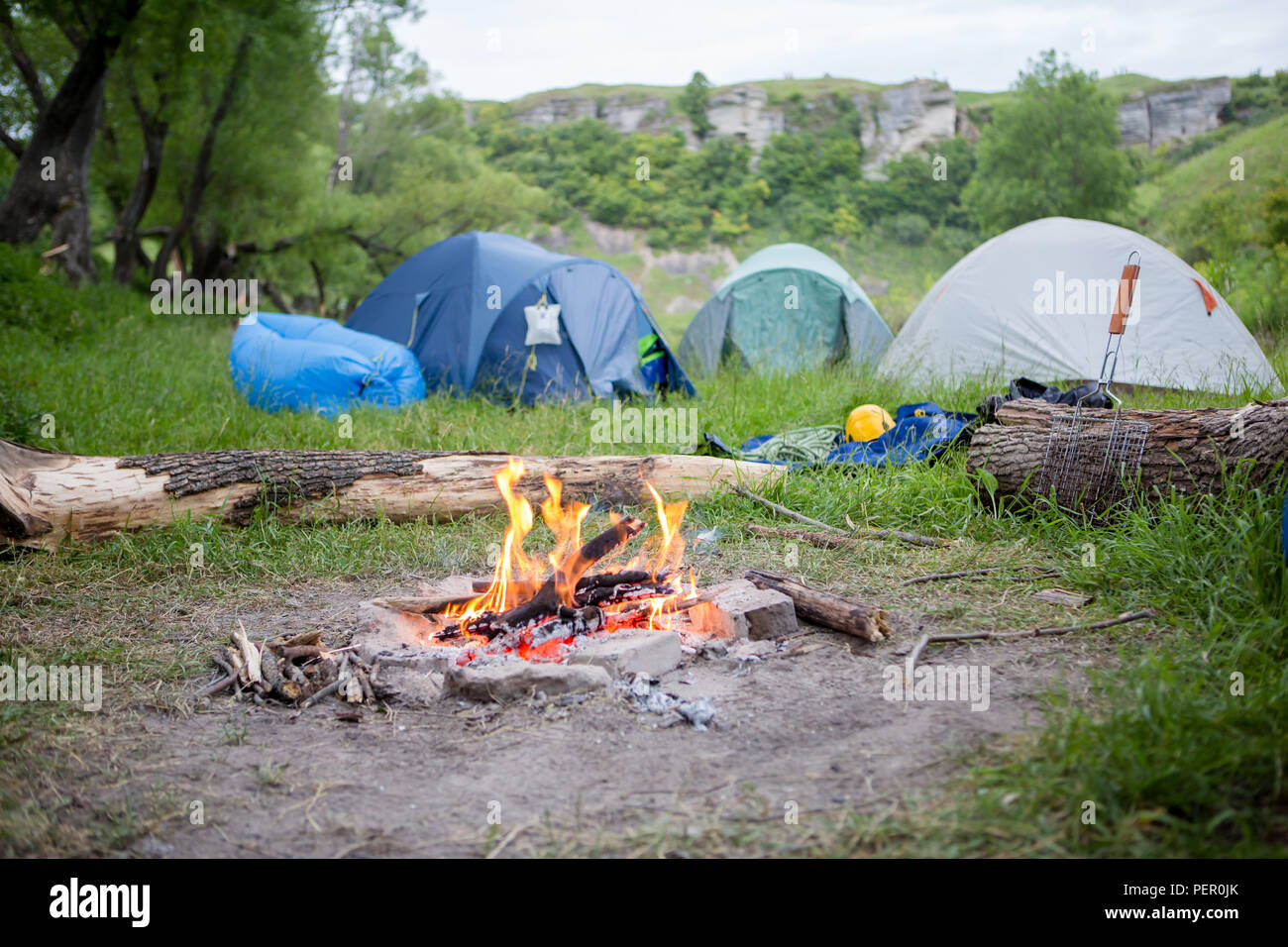 Photo of campground and campfire in forest Stock Photo - Alamy