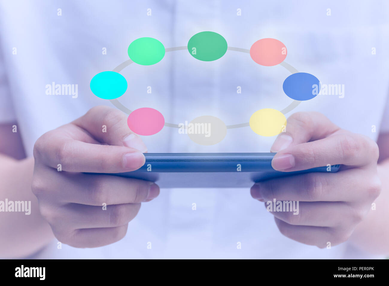 Conceptual young people using cell phone with colorful circle digital ...