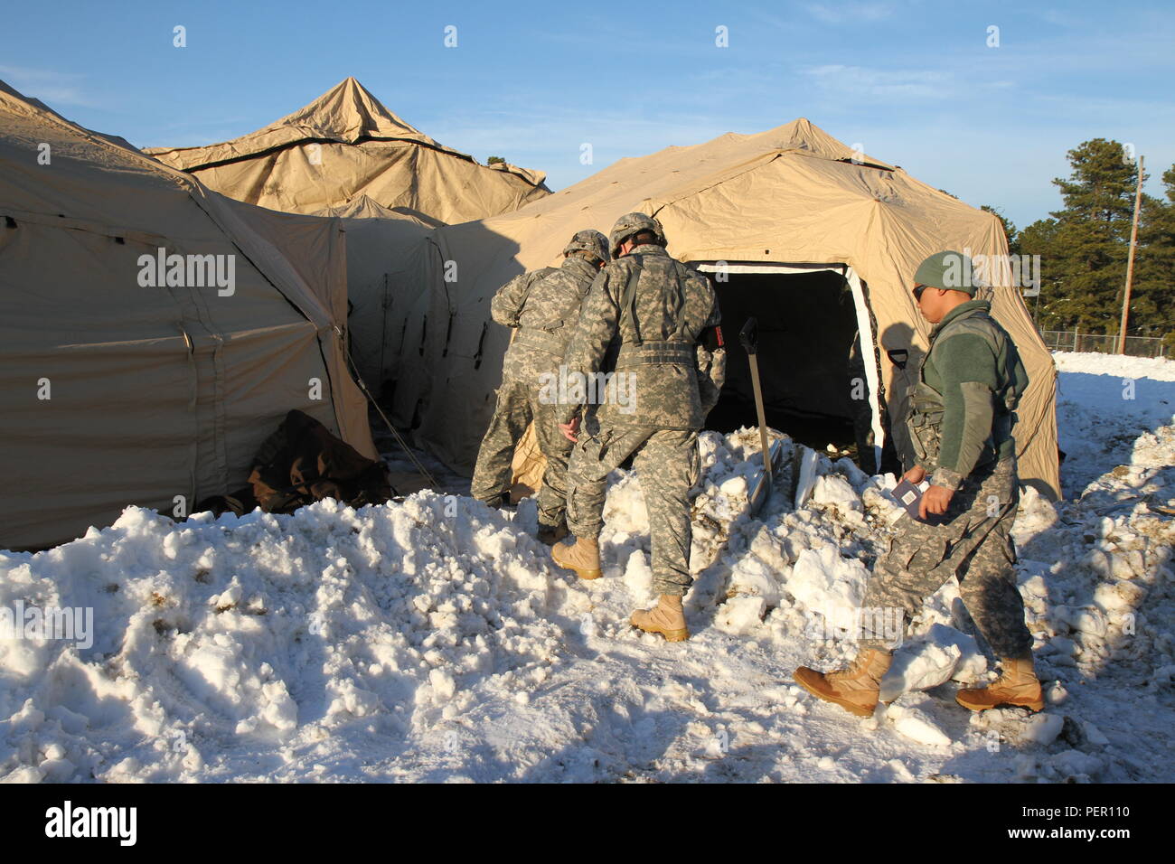 U.S. Army Soldiers of the 78th Training Division enter a modular tent ...