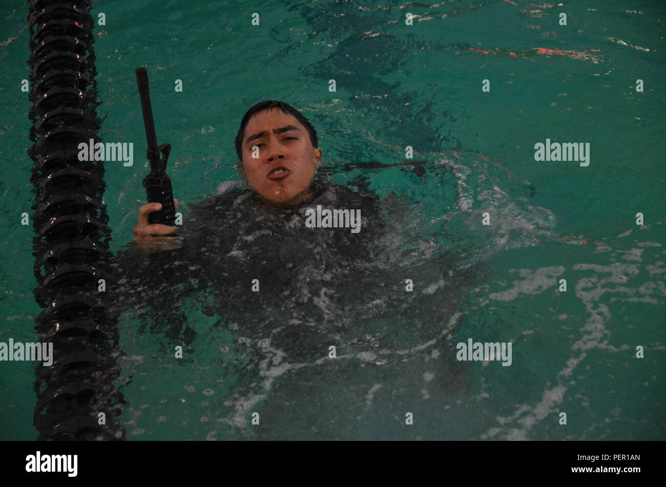 A soldier from HHB, 18th Field Artillery Brigade, makes his way down a ...