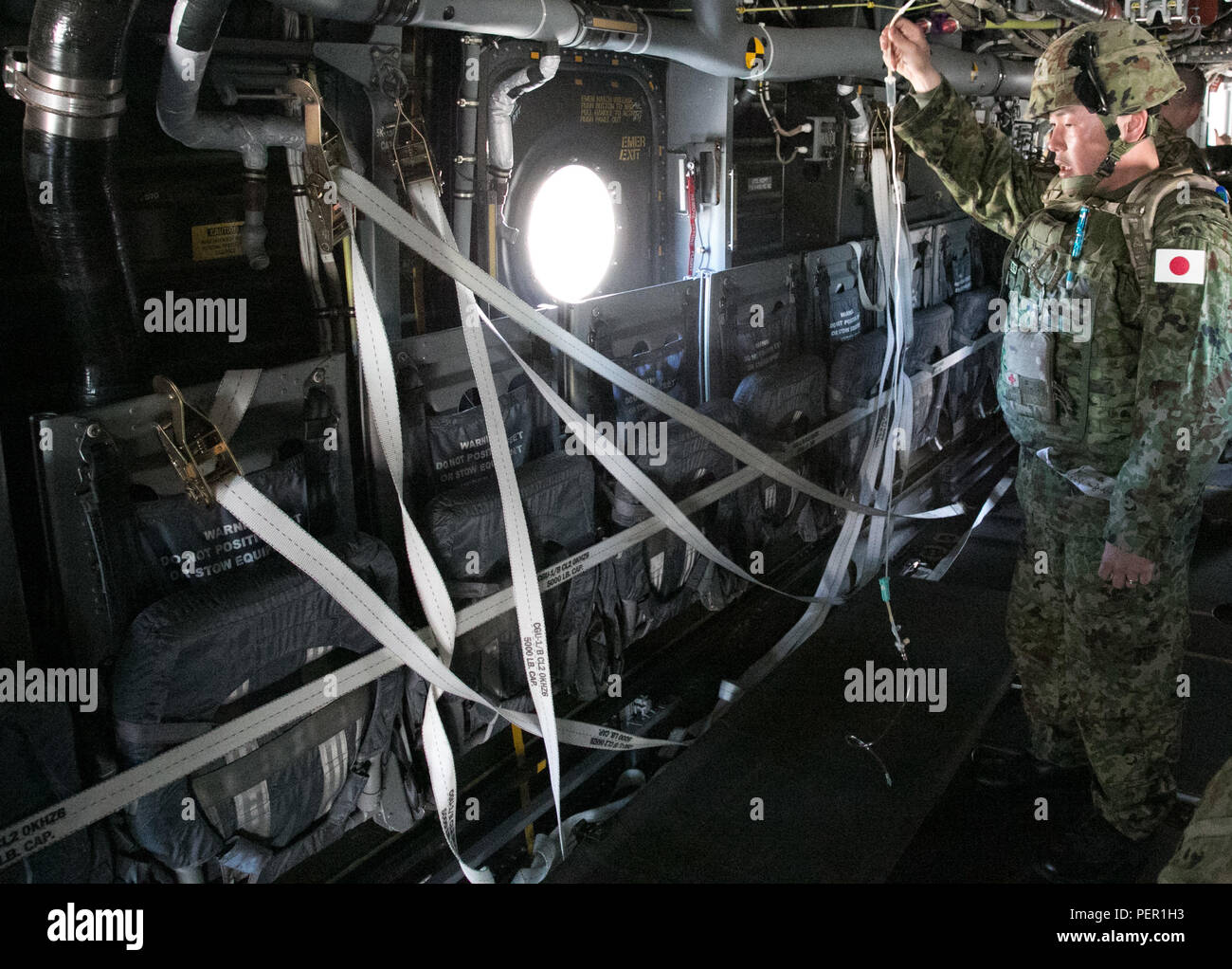 Japan Ground Self-Defense Force (JGSDF) soldiers take measurements of ...