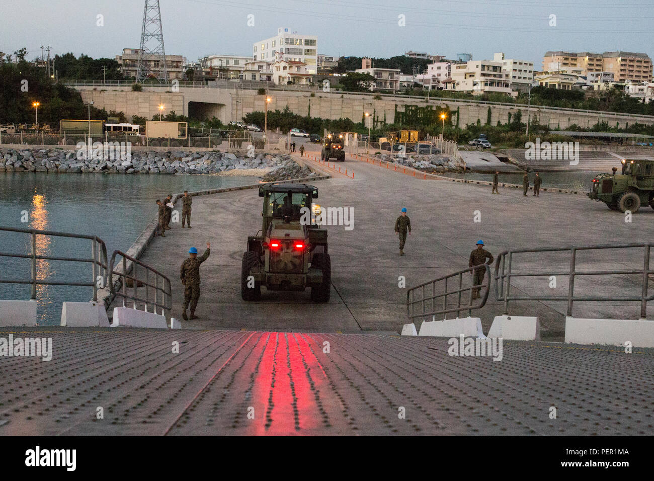 U.S. Marines with 1st Battalion, 3rd Marine Regiment, load the MV ...