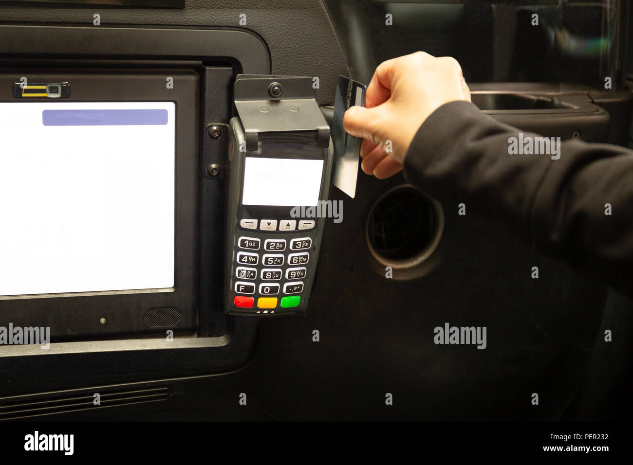 Passenger paying taxi fare with credit card in card reader Stock Photo ...