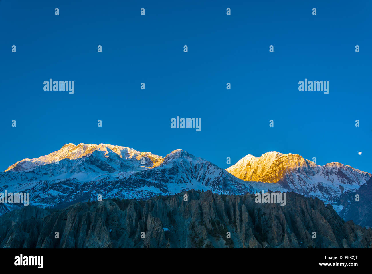 Colorful orange dawn over the mountain ranges in the Himalayas, Nepal ...