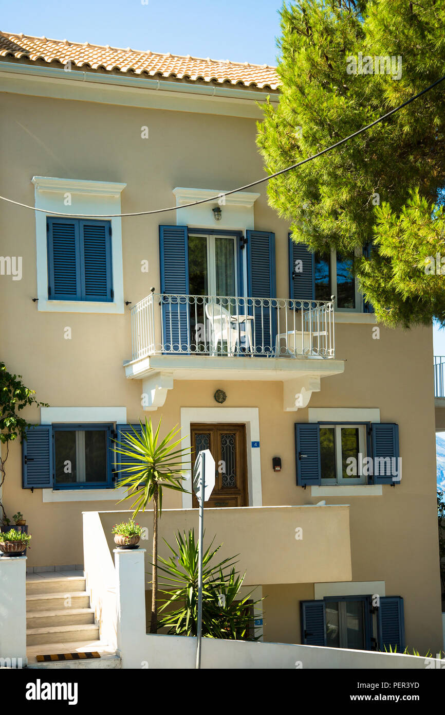 Traditional Greek houses and streets. Buildings with blue shutters ...