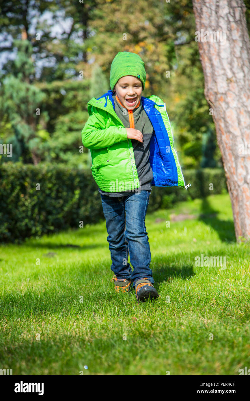 Kid runs in the park hi-res stock photography and images - Alamy