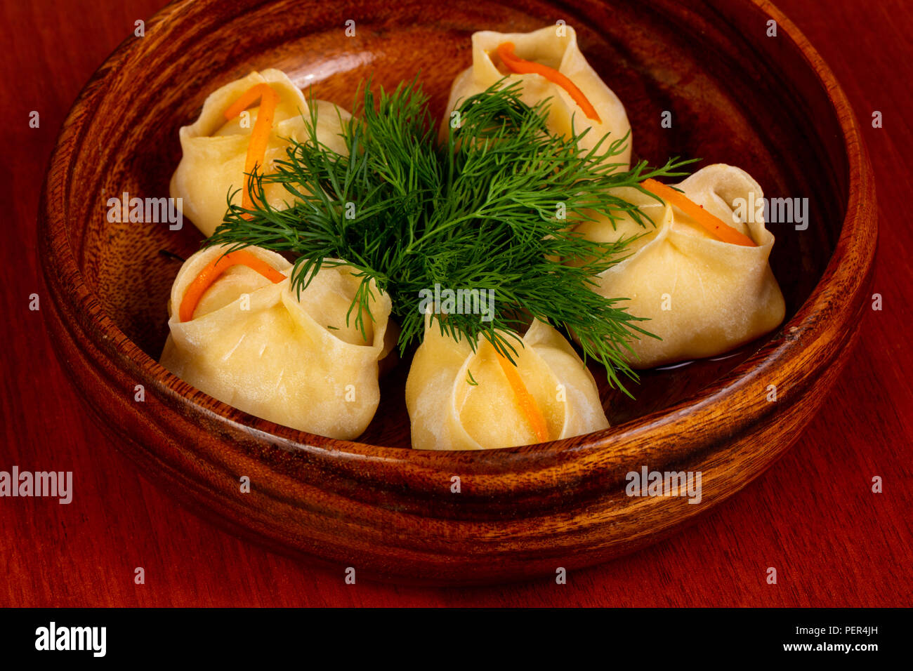 Uzbek traditional dumplings - Manti with meat Stock Photo - Alamy