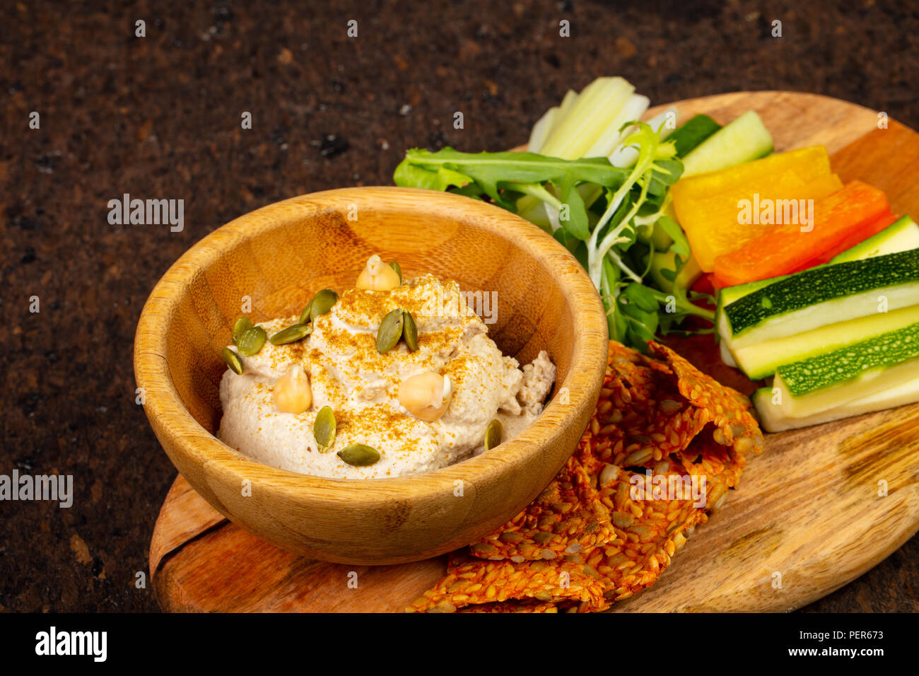 Delicious humus with pepper, cucumber and zuccini Stock Photo - Alamy